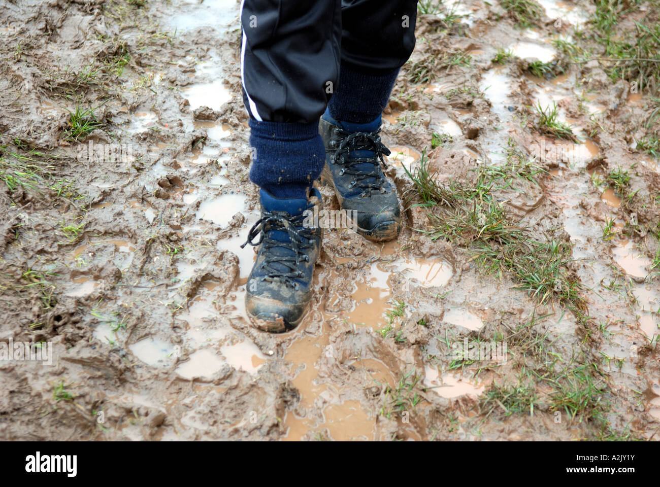 Hiking along muddy path Stock Photo - Alamy