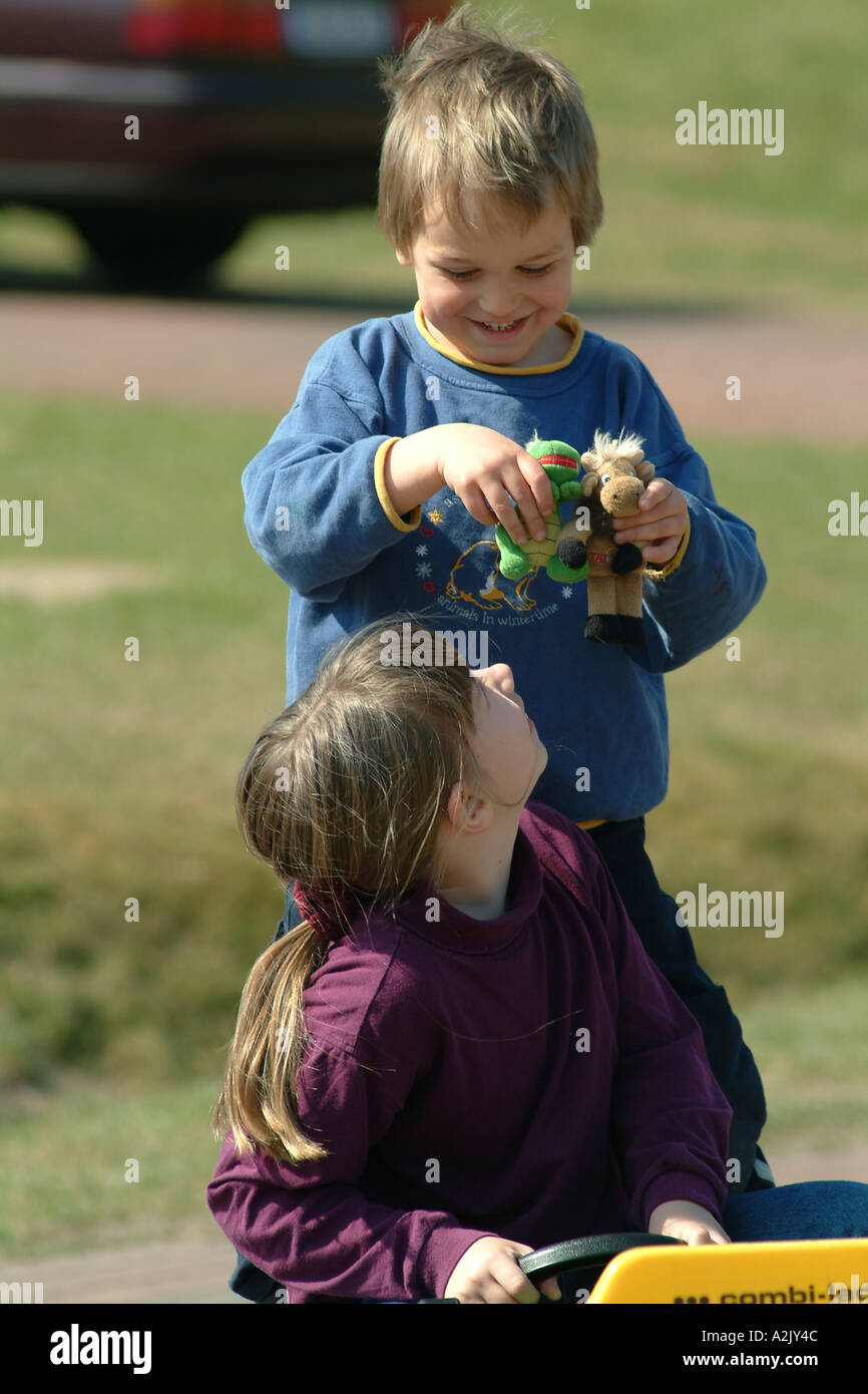 children play with figures Stock Photo - Alamy