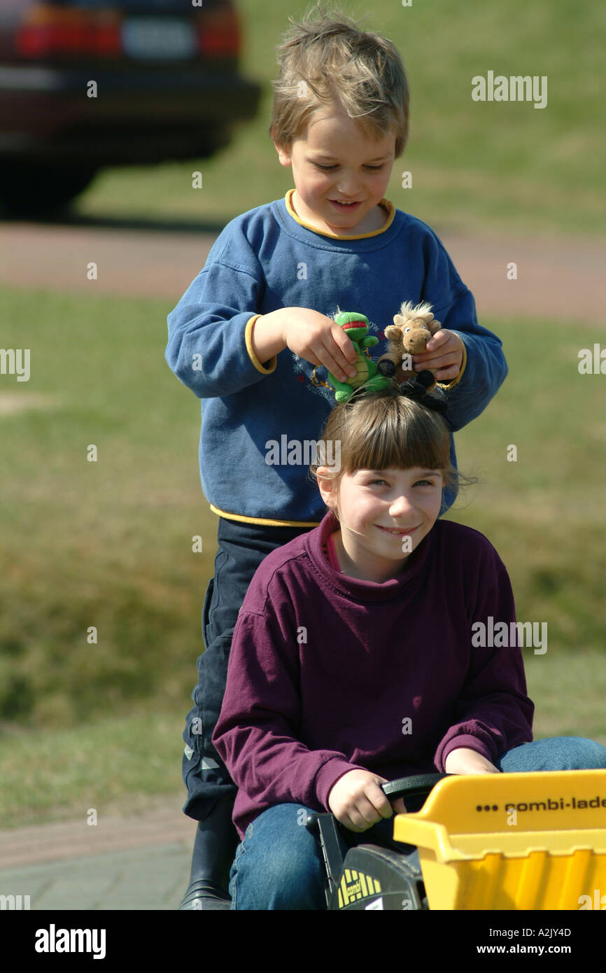 children play with figures Stock Photo - Alamy