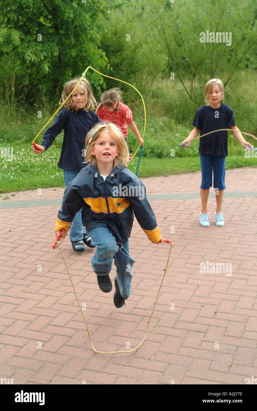 Children skipping with rope hi-res stock photography and images - Alamy
