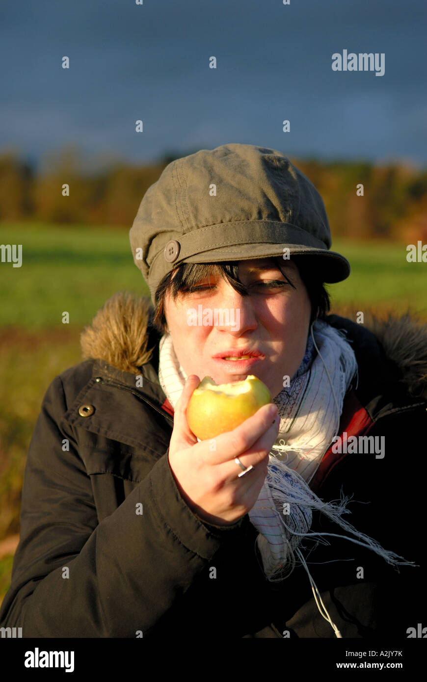 Teenager eating an Apple Stock Photo - Alamy