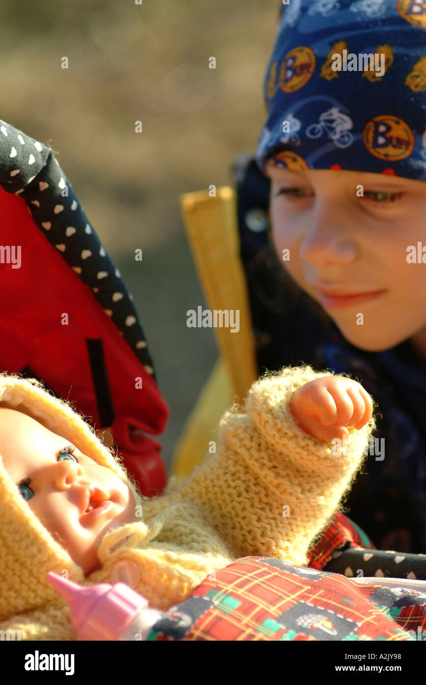 child play with doll Stock Photo - Alamy