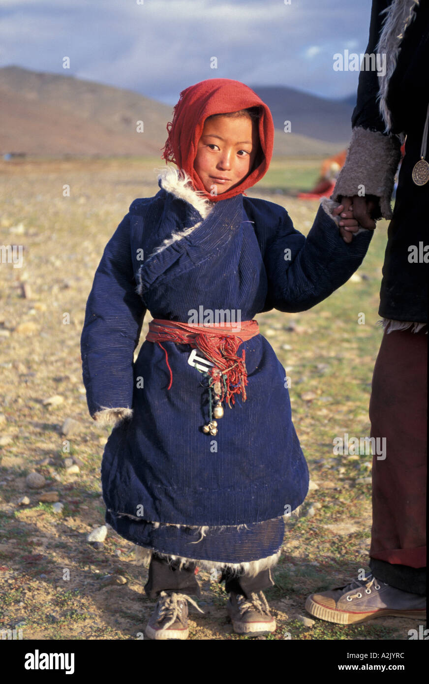 Tibetan child holding hands hi-res stock photography and images - Alamy