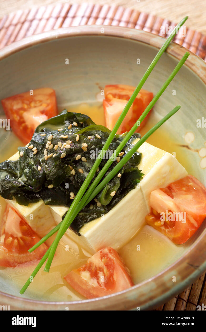 Japanese Tofu Salad Chilled tofu with wakame seaweed and tomato in a miso sauce Stock Photo - Alamy