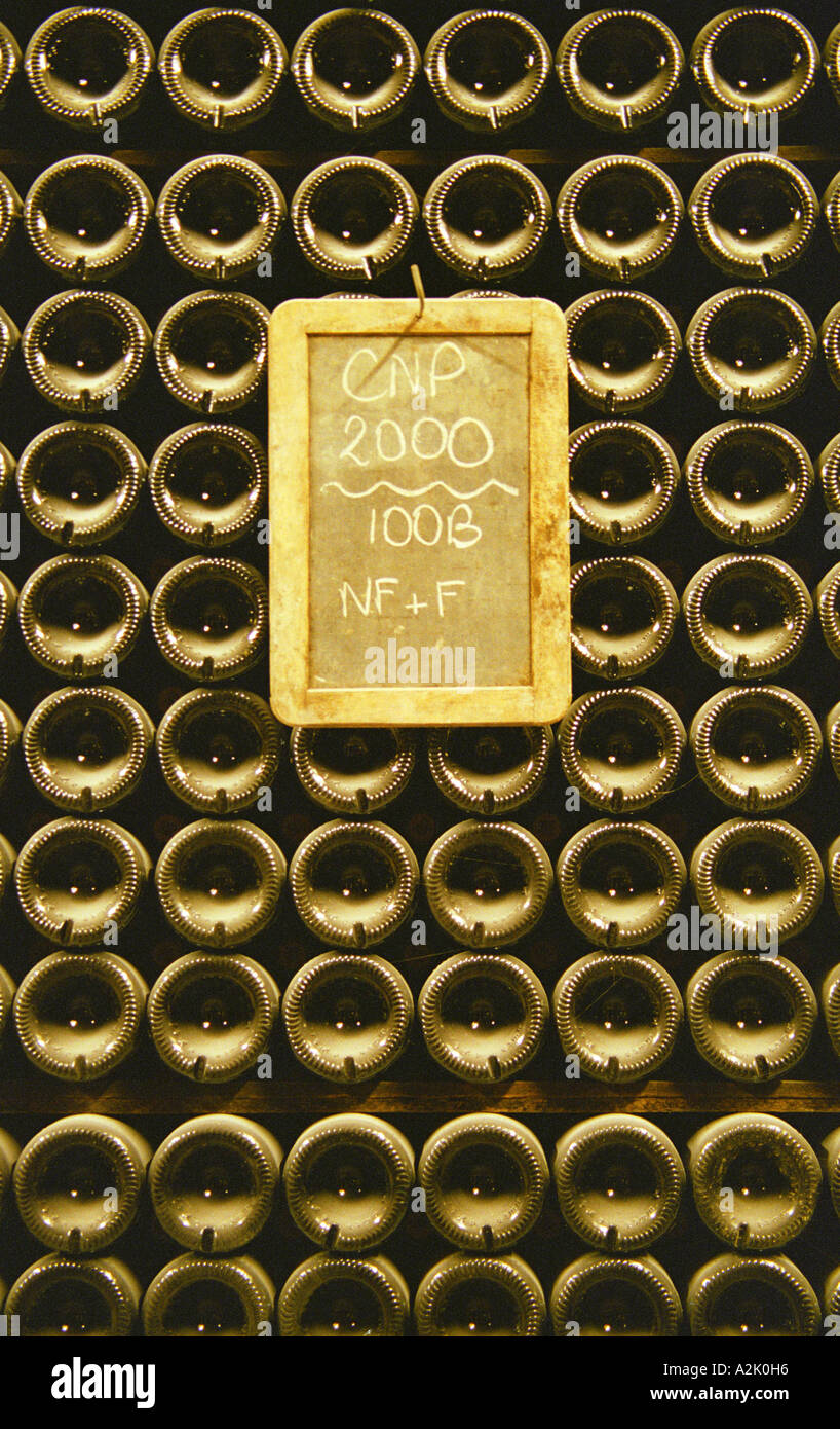 A big pile of bottles in the bottle aging cellar with a chalk board ...