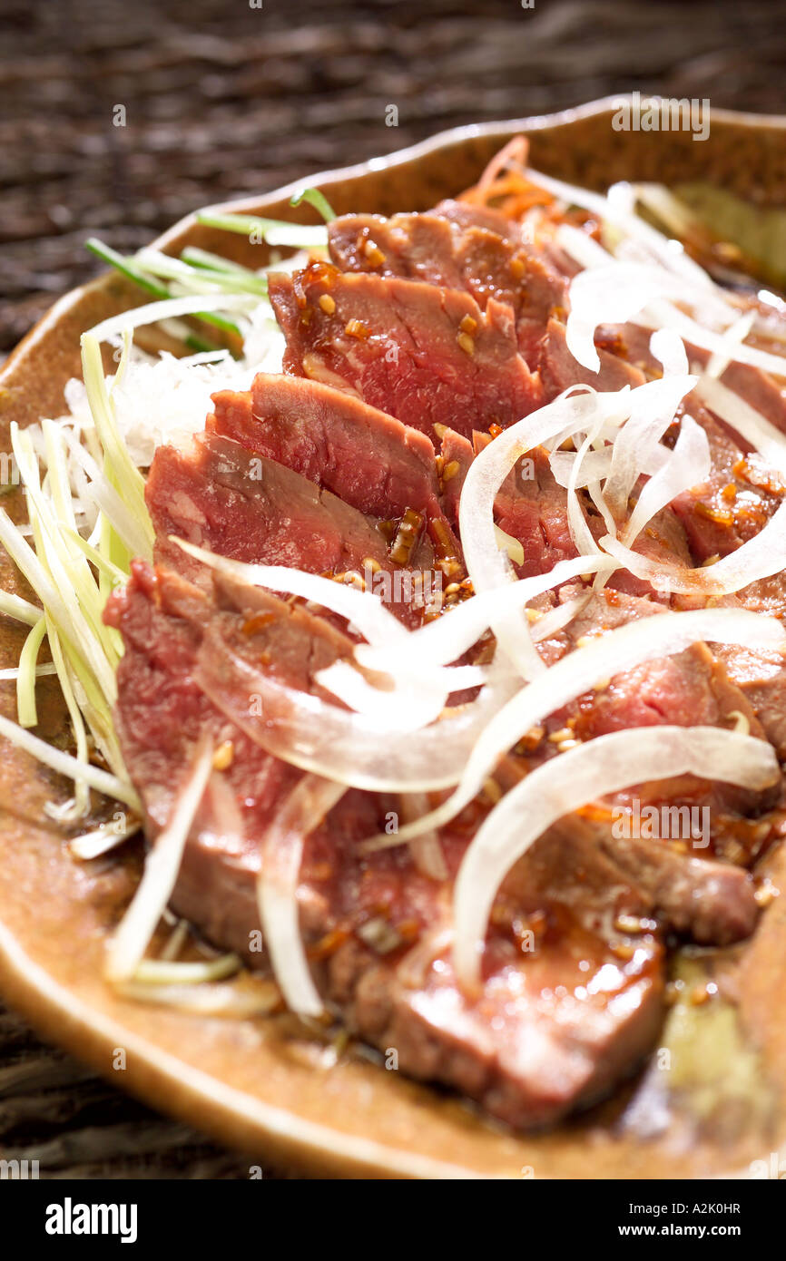 Japanese Gyu Tataki Sliced and seared beef with onion Stock Photo - Alamy