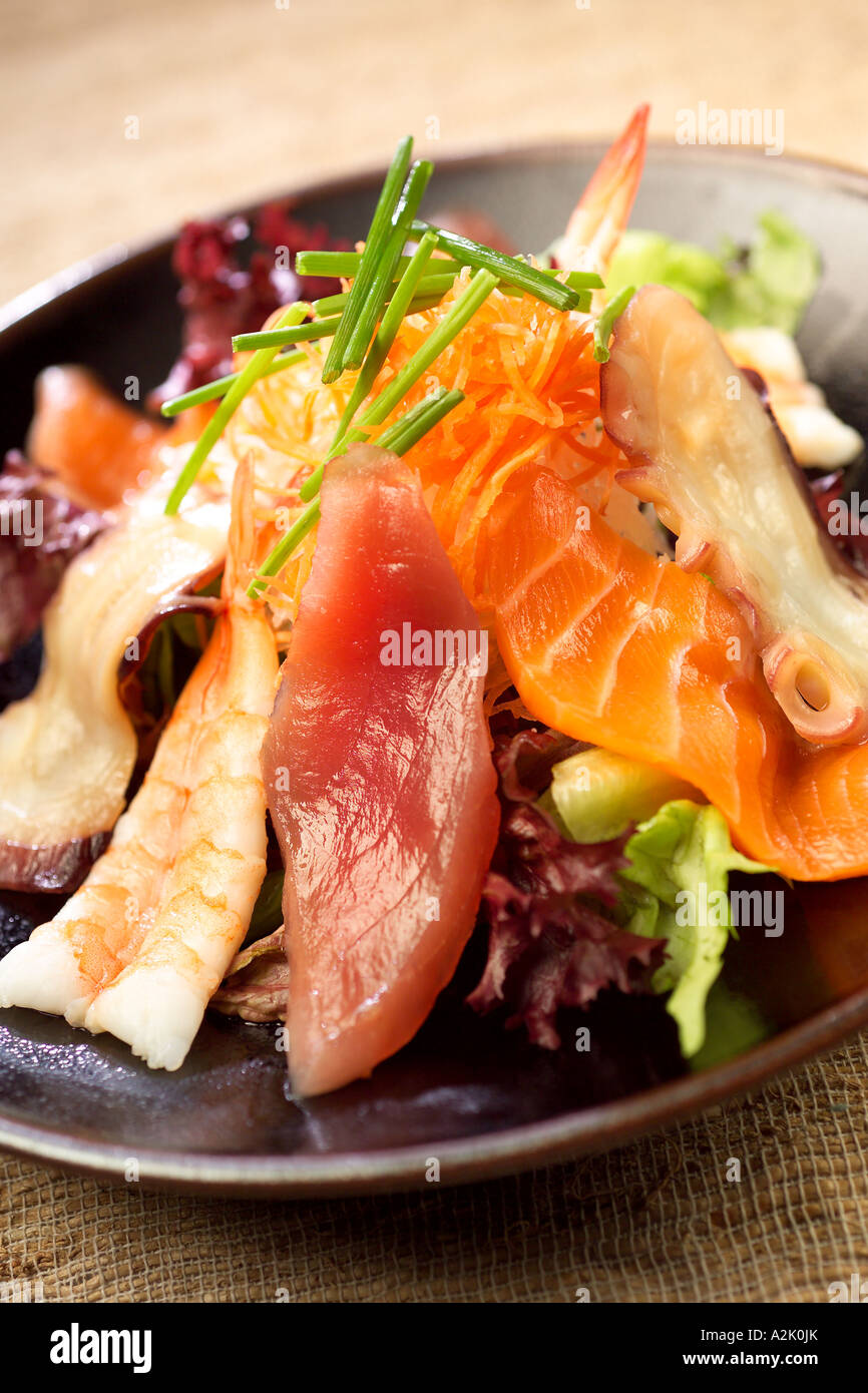 Japanese Sashimi salad A selection of raw fish and seafood served with ...