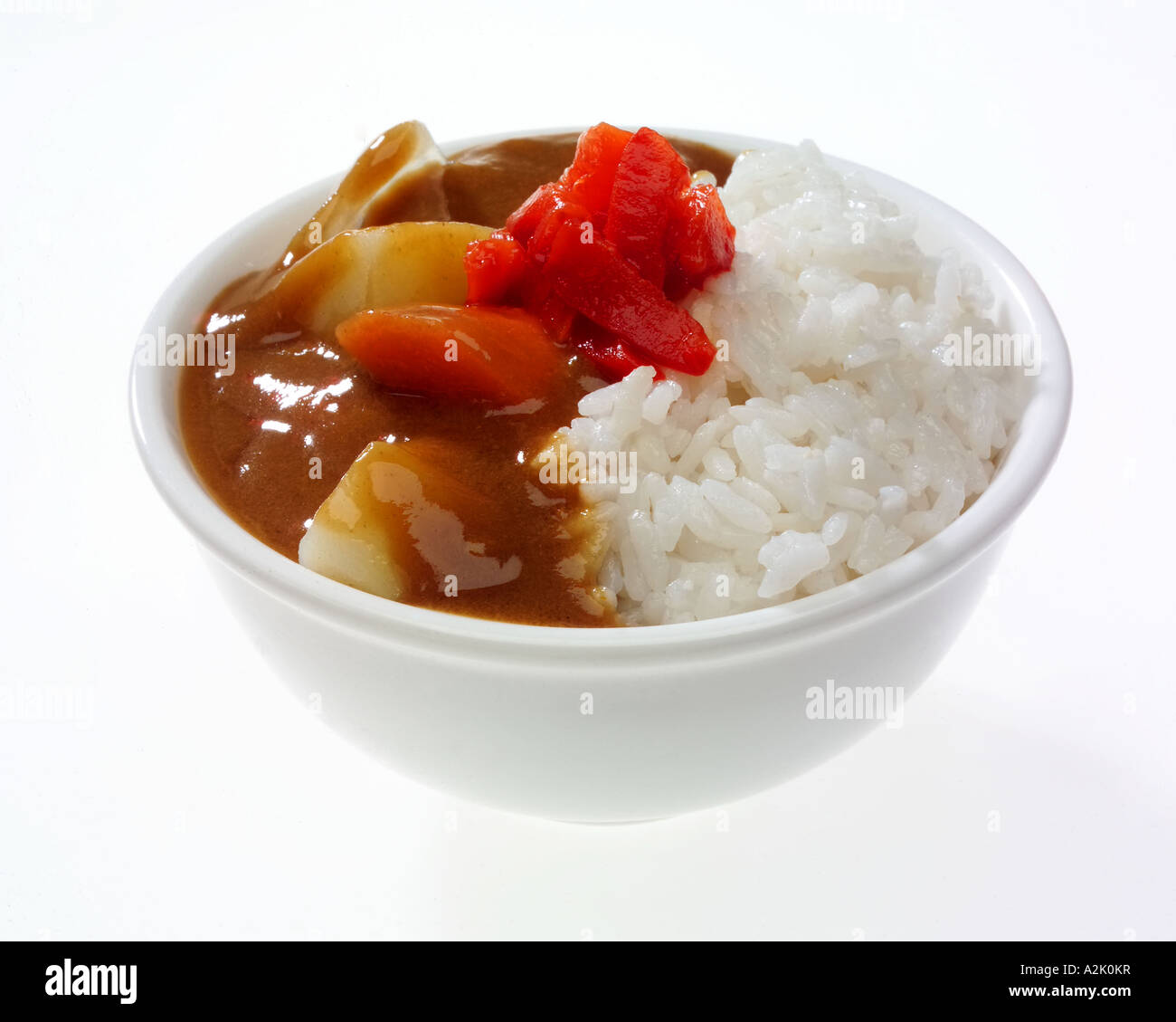 Japanese Yasai vegetable curry served with rice and garnished with red ...