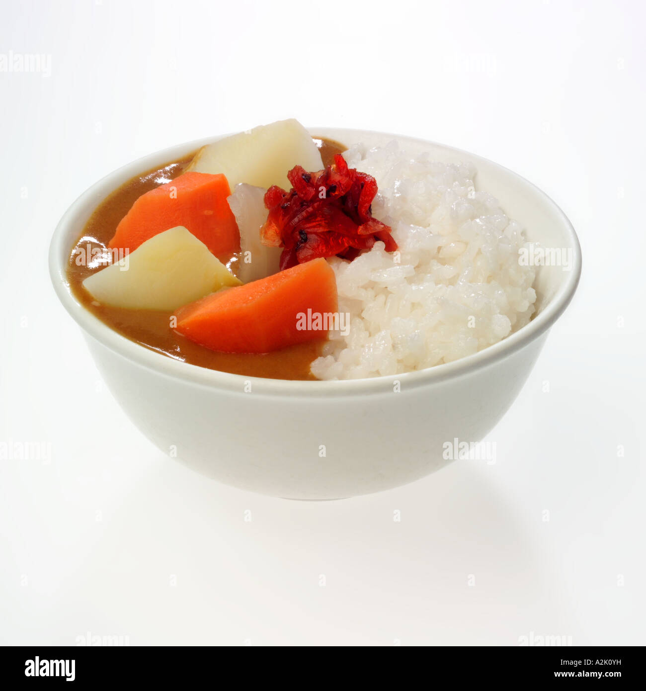 Japanese Yasai vegetable curry served with rice and garnished with red ...
