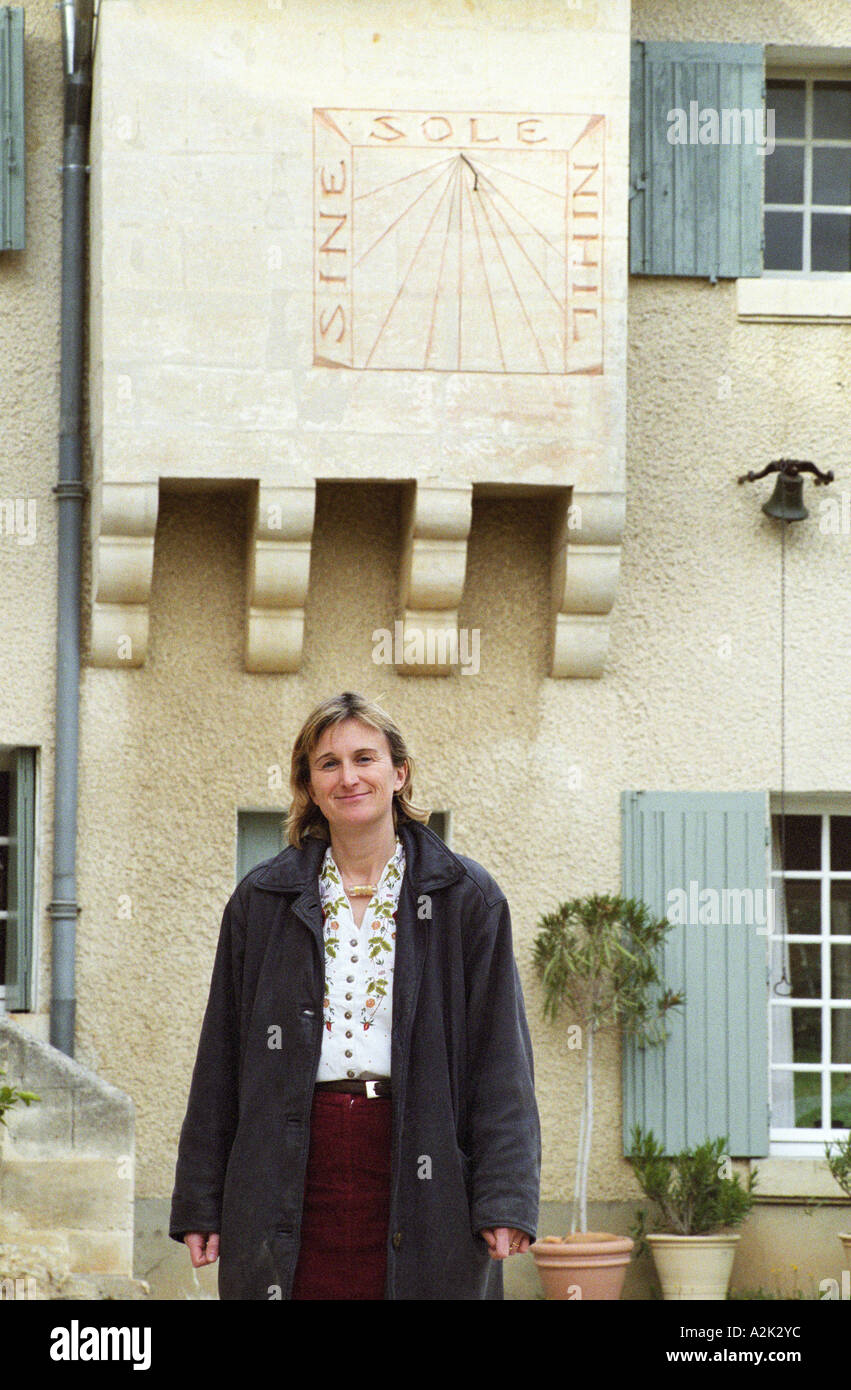 Anne collard in front of the sun dial with inscription Sine Sole Nihil ...