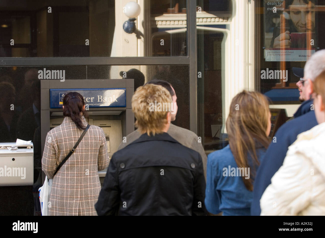 Queue at ATM Stock Photo - Alamy