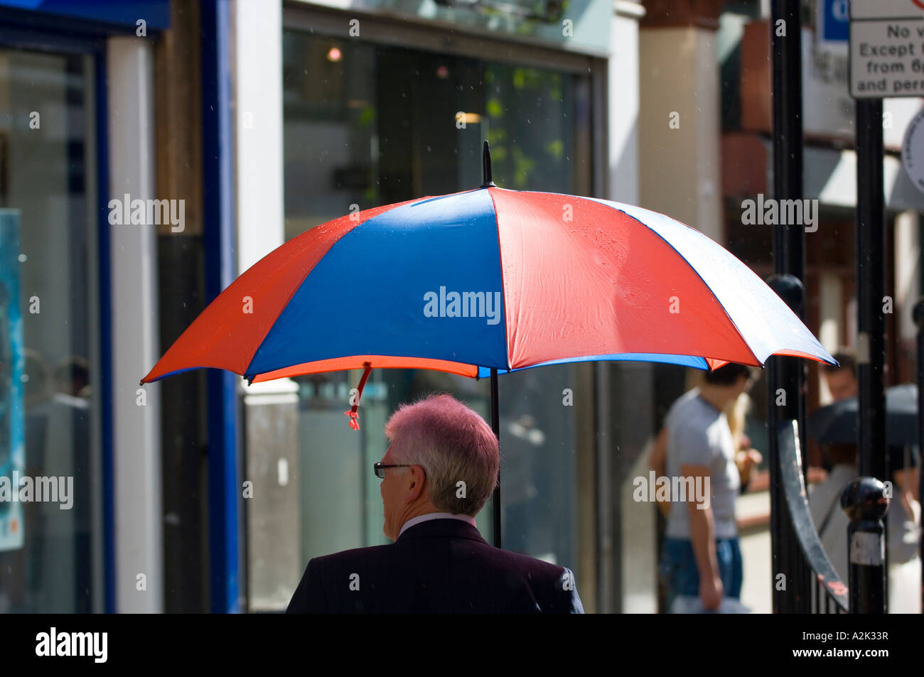 umbrella in rain show Belfast Stock Photo - Alamy