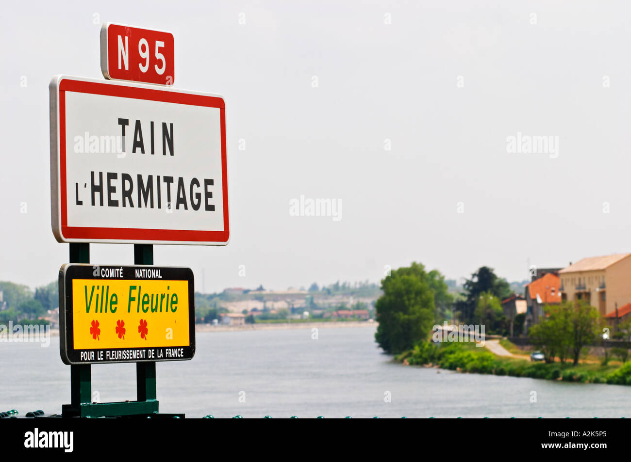 A road sign at the entrance to the town Tain l'Hermitage. Tain l ...
