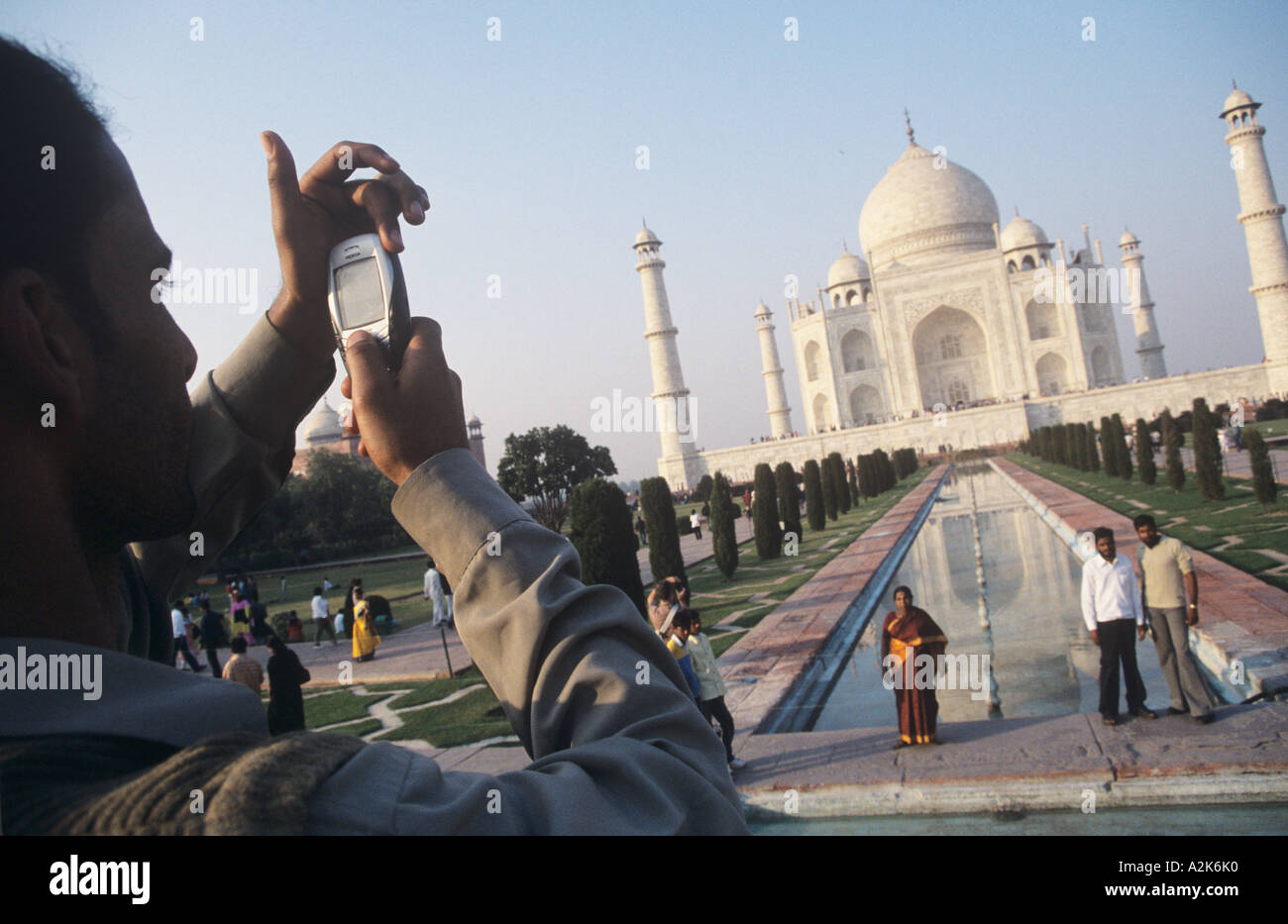 India, A local tourist photographs the Taj Mahal with his camera phone ...