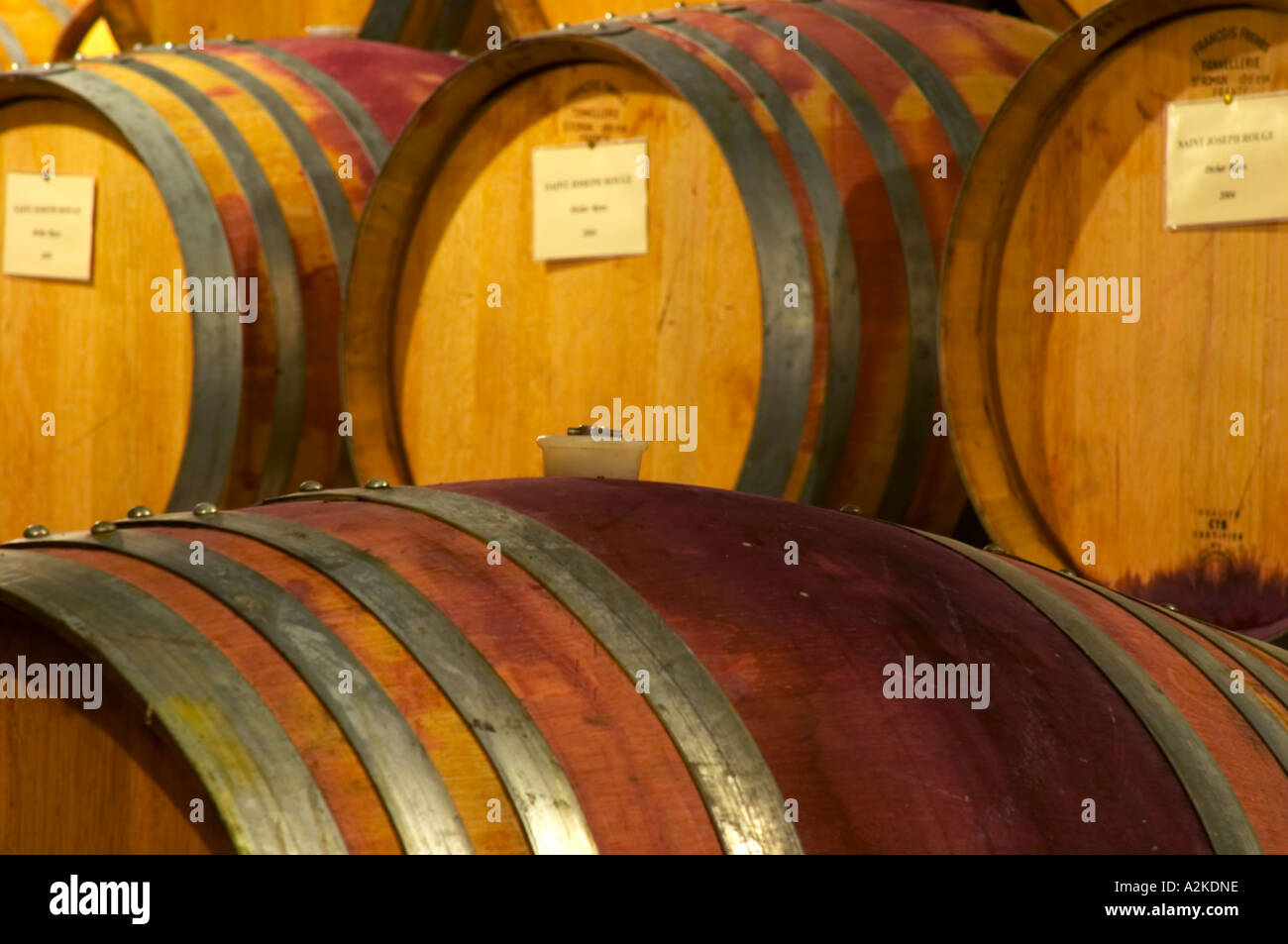 Oak barrels for aging wine in the wine cellar. Domaine Yves Cuilleron ...