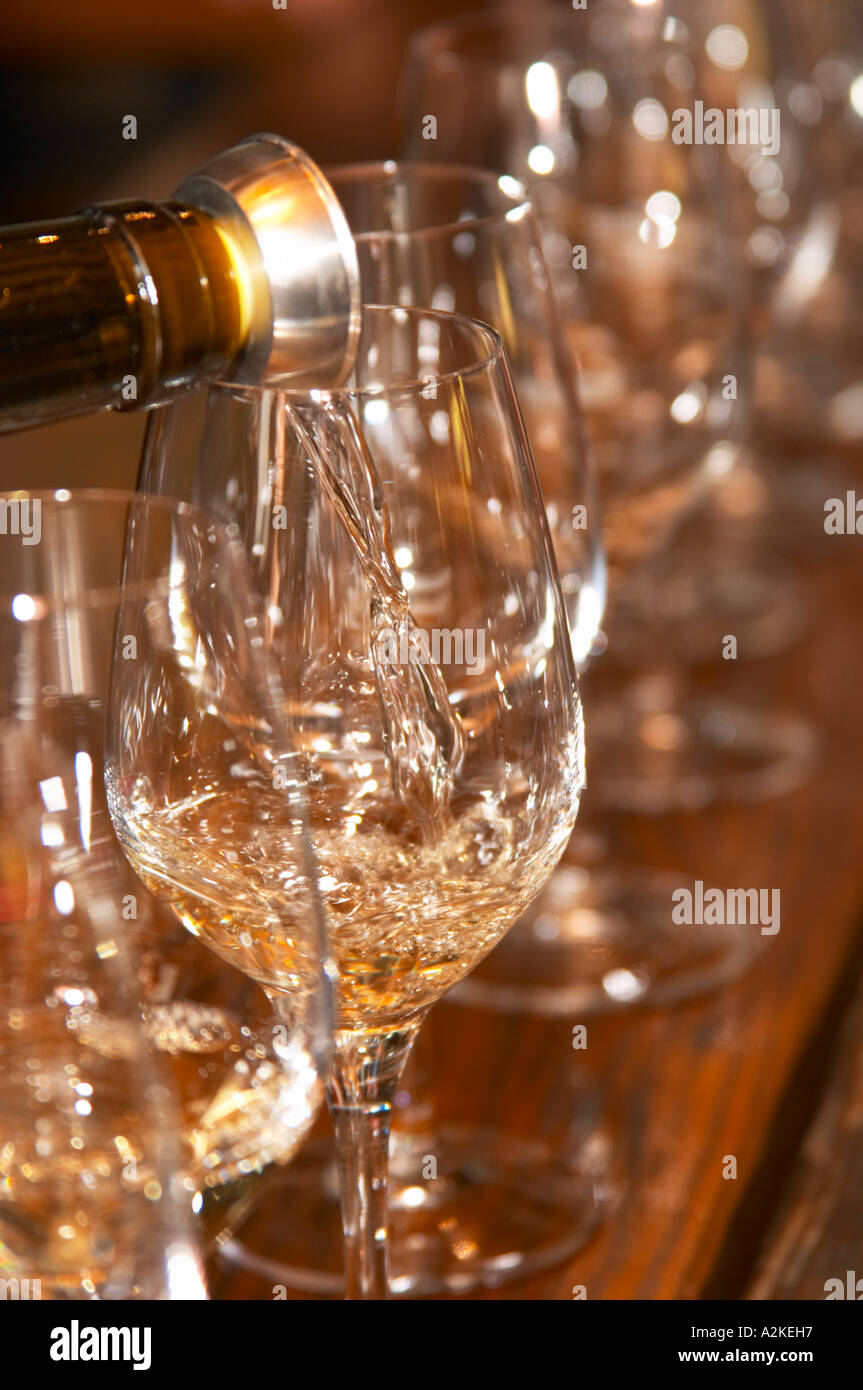 Pouring a glass of George Vernay's Condrieu at a wine tasting. Glass ...