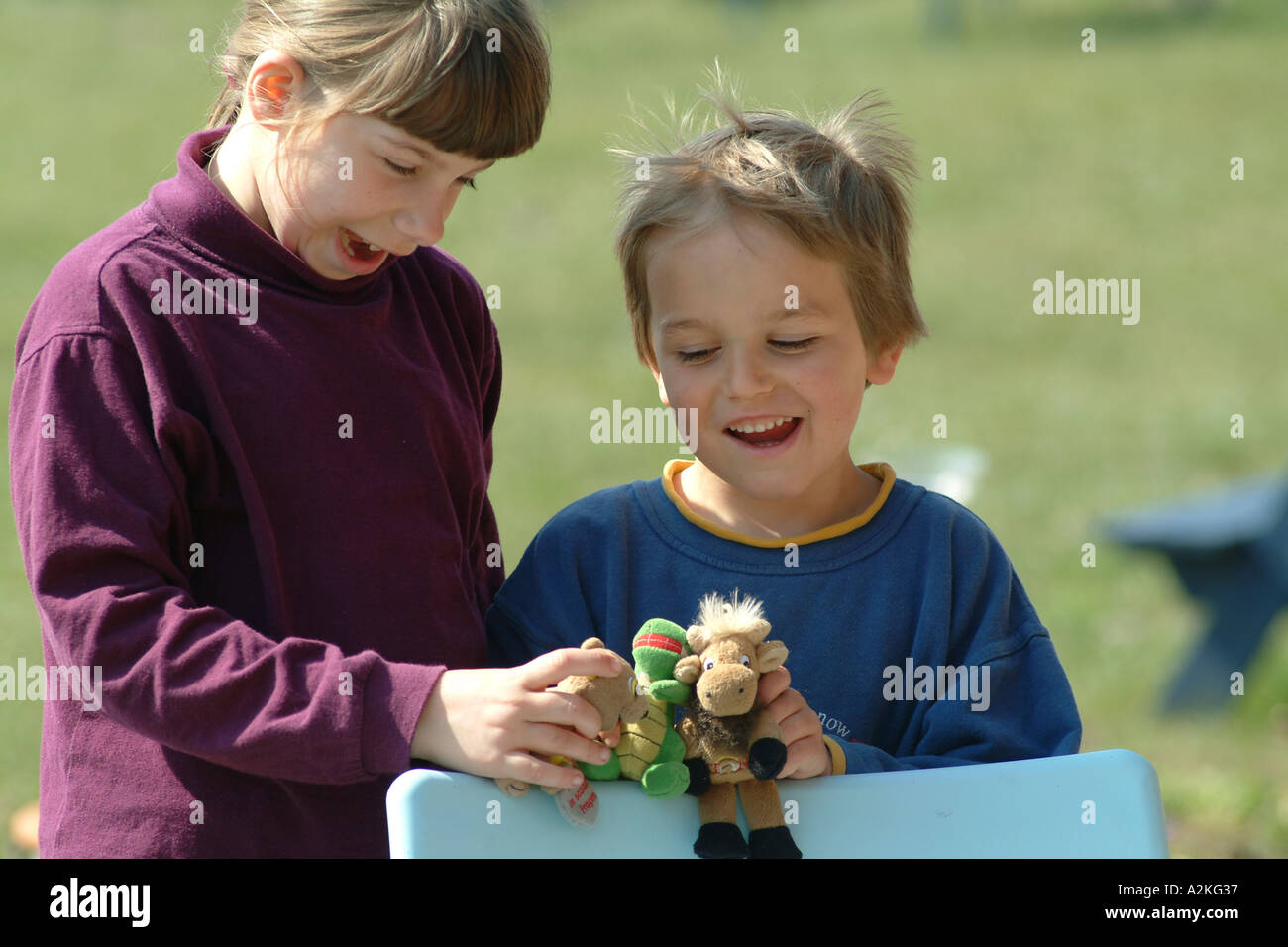 children play with figures Stock Photo - Alamy