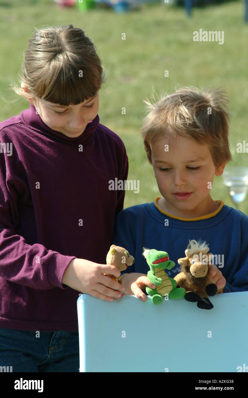 children play with figures Stock Photo - Alamy