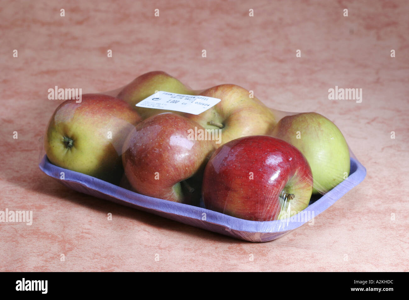 Supermarket apples packed with foil and label Stock Photo - Alamy