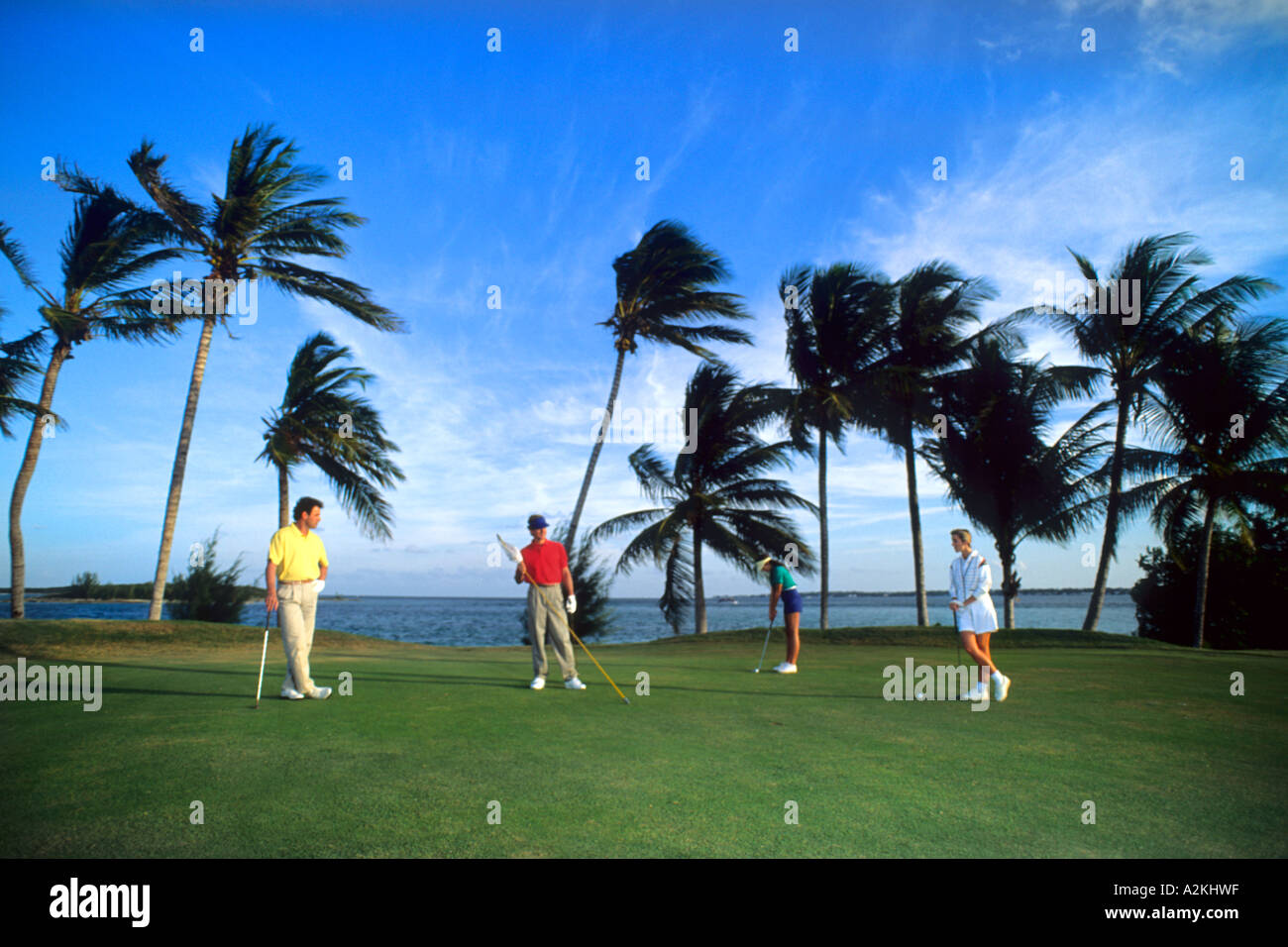 Couples 20s and 30s having fun at golf course in Freeport Bahamas at ...