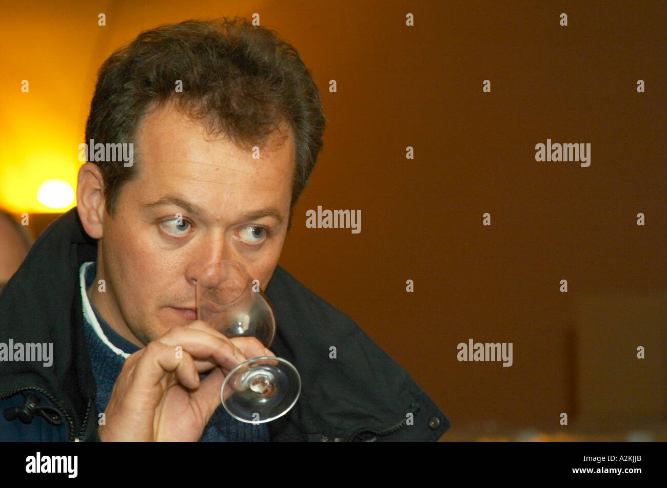 Gilles Robin, owner and winemaker tasting a glass of wine. Domaine ...