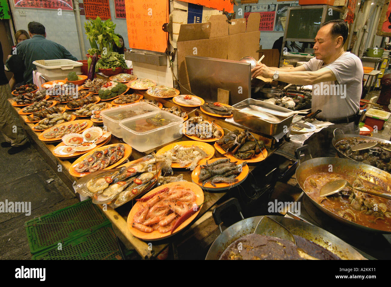 Open kitchen with fresh seafood at a nightmarket in Hong Kong Stock ...