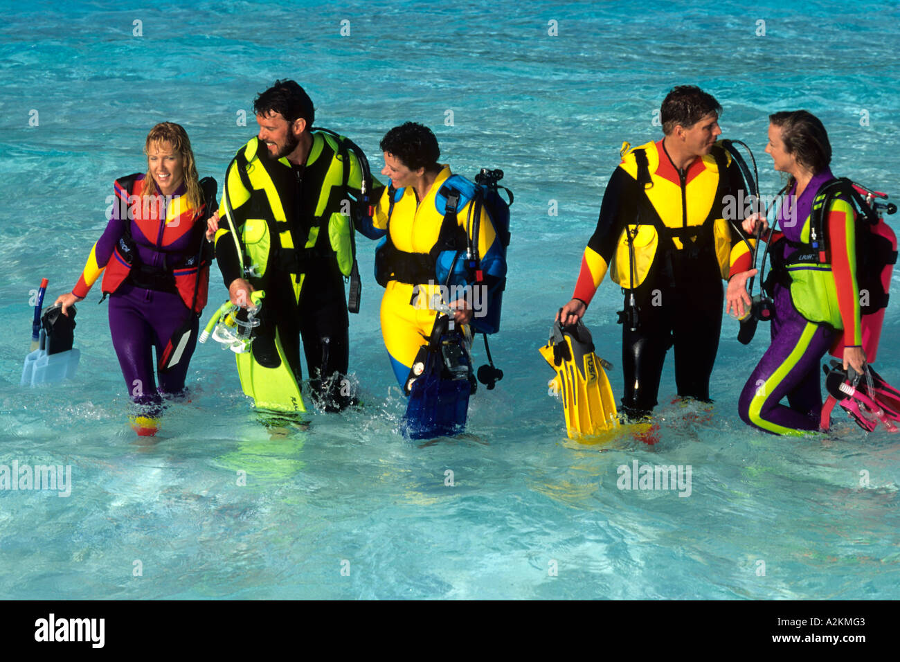 Colorful scuba divers at beach with equipment and fun energy Stock ...