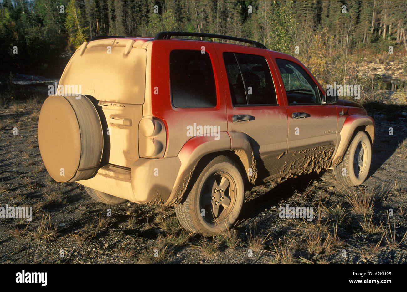 mud encrusted red car or SUV Stock Photo - Alamy