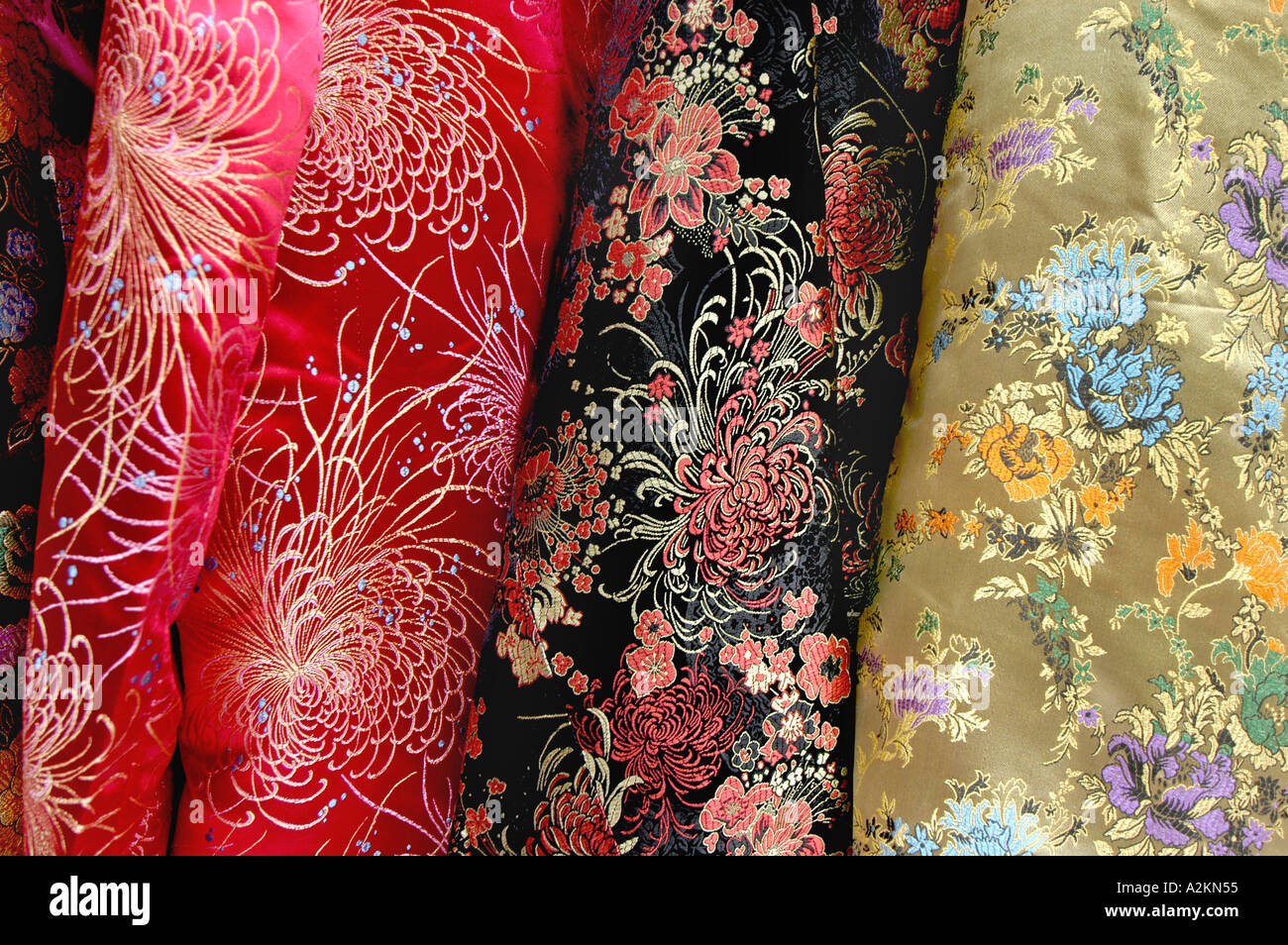 colorful silk clothes with embroideries hanging at a market booth Stock ...