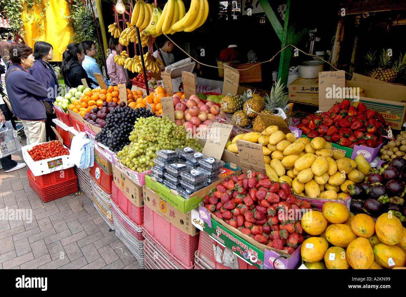 Fruit and vegetable booth at a market Stock Photo - Alamy