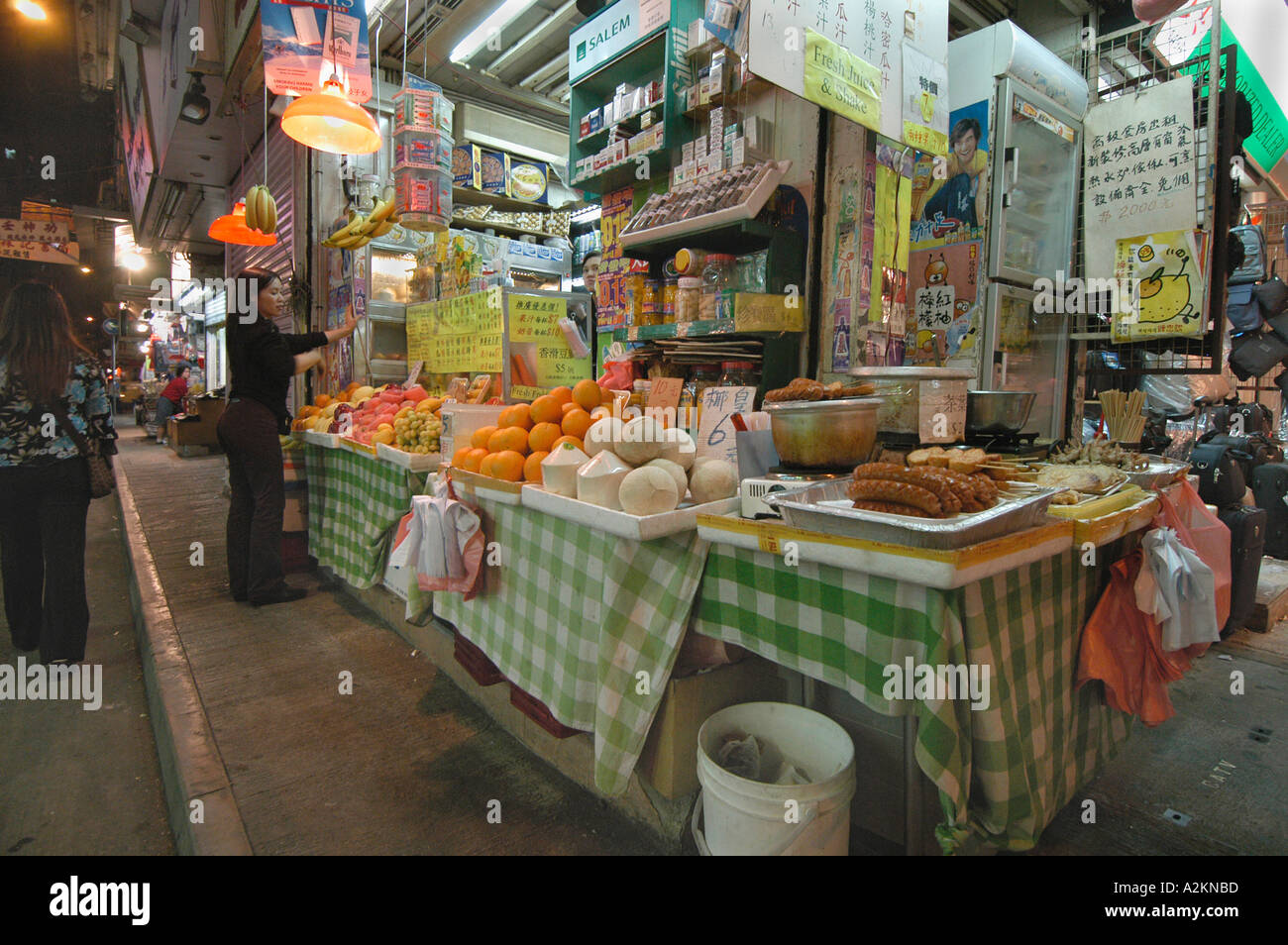 fast food stand or open kitchen at a night market in Kowloon Stock ...