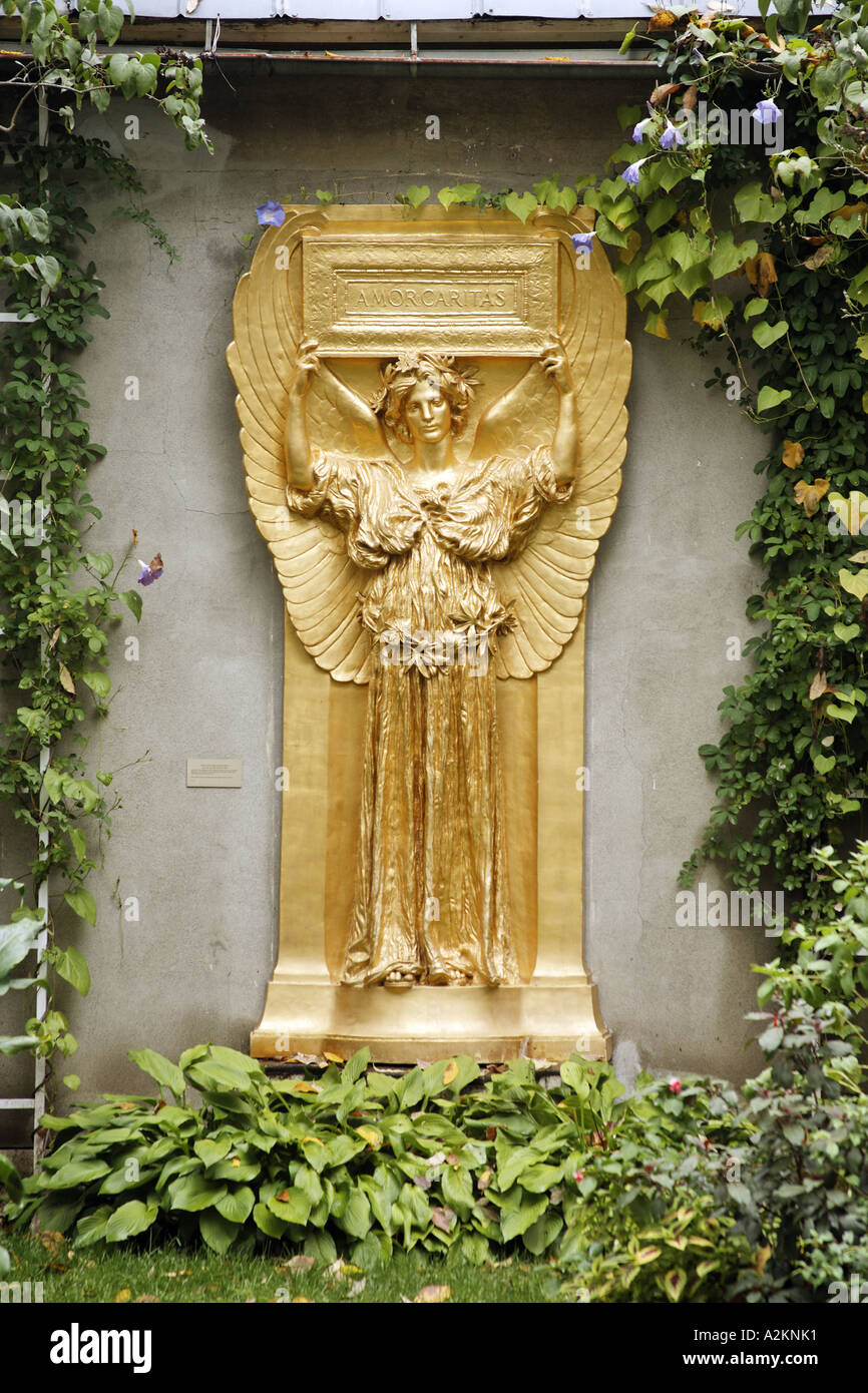 Golden relief of female angel in garden setting New Gallery atrium ...