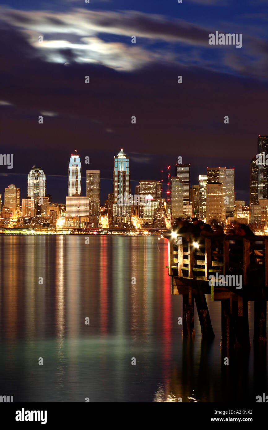 Squid fishermen on pier with Seattle skyline and Elliot Bay in ...