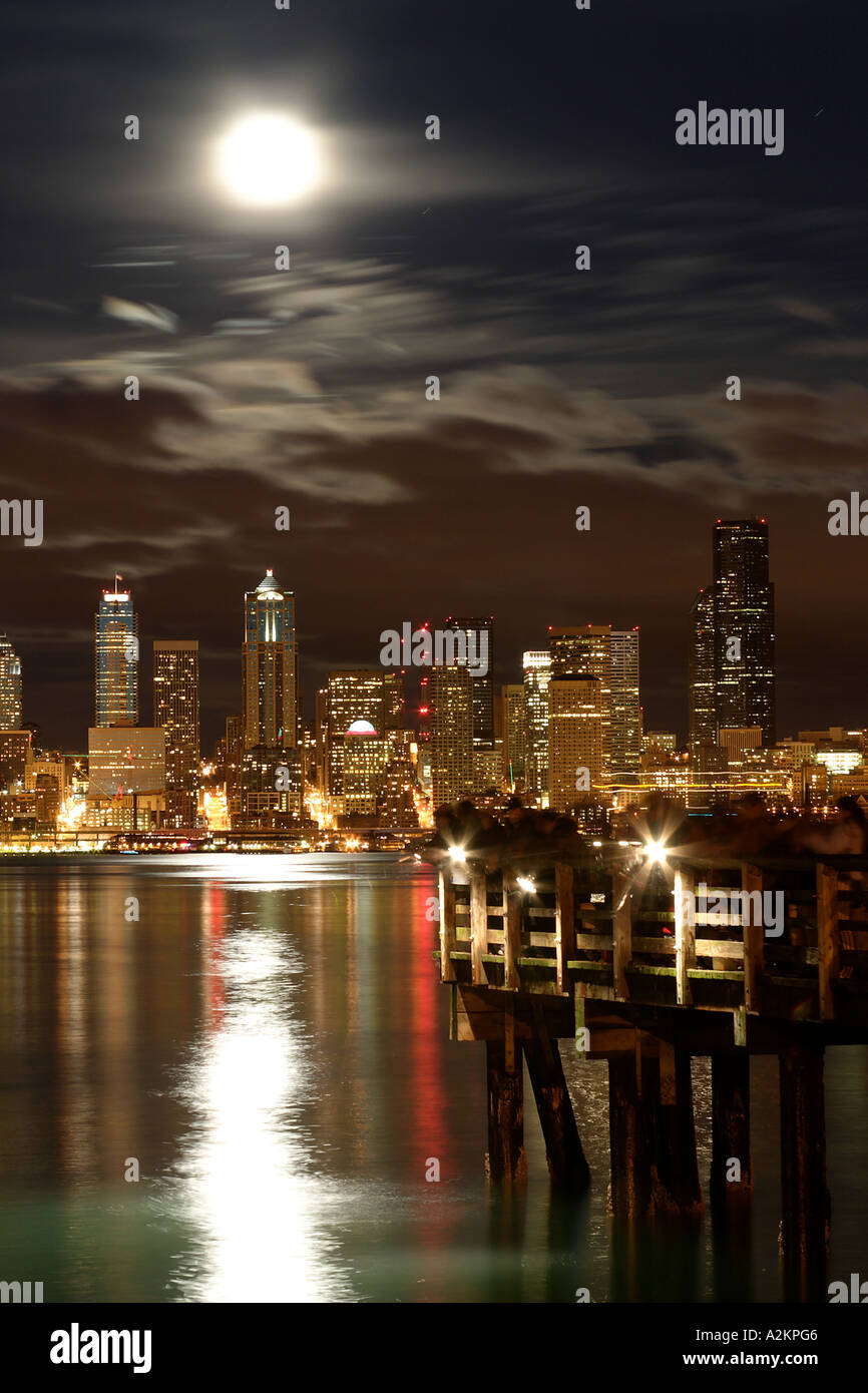 Squid fishermen on pier with Seattle skyline and Elliot Bay in ...