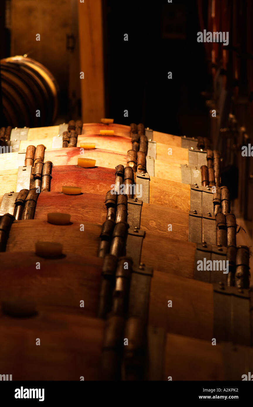 The aging cellar with oak barrels and larger wooden vats. Chateau de ...