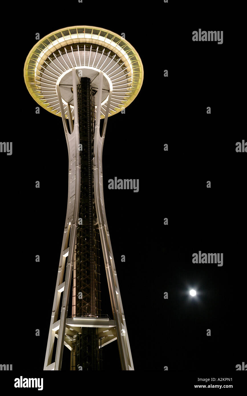 Nighttime scene of Seattle Space Needle towering above full moon ...