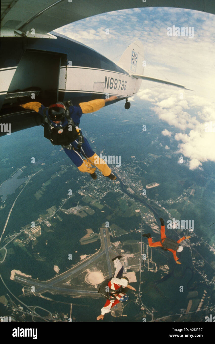 Three skydivers jump from an aircraft 5 000 feet over Orange ...