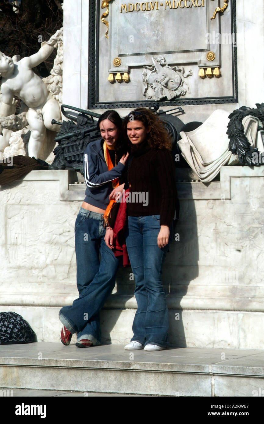 Two female Student tourists standing underneath Mozart's statue in ...