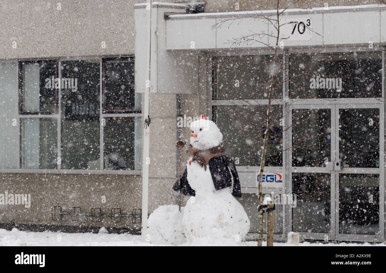 Office workers have built a snowman outside an office building near ...