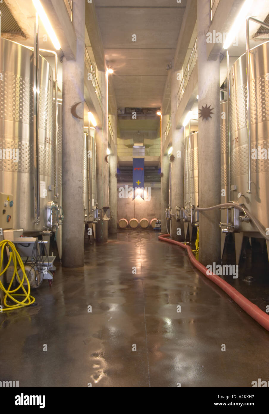The vat hall with stainless steel fermentation vats and solar symbols ...