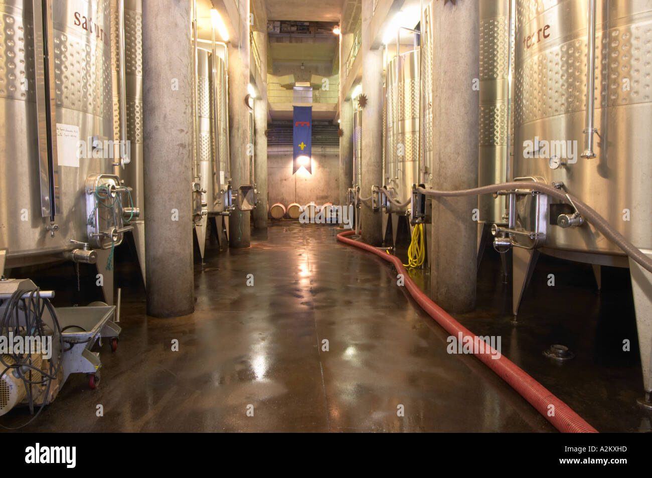 The vat hall with stainless steel fermentation vats and solar symbols ...
