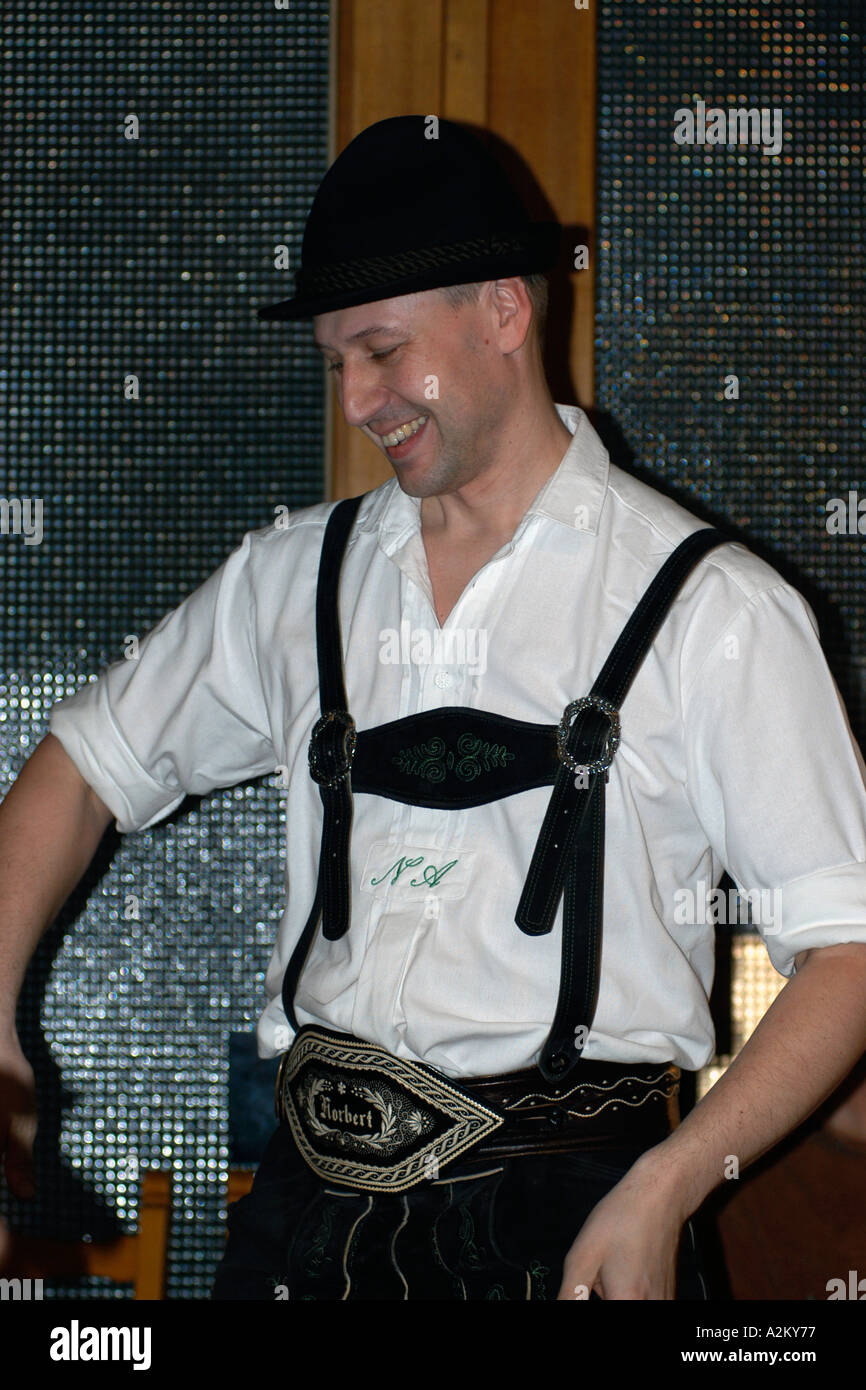 Austrian man wearing lederhosens for the tourists at a hotel in Austria ...