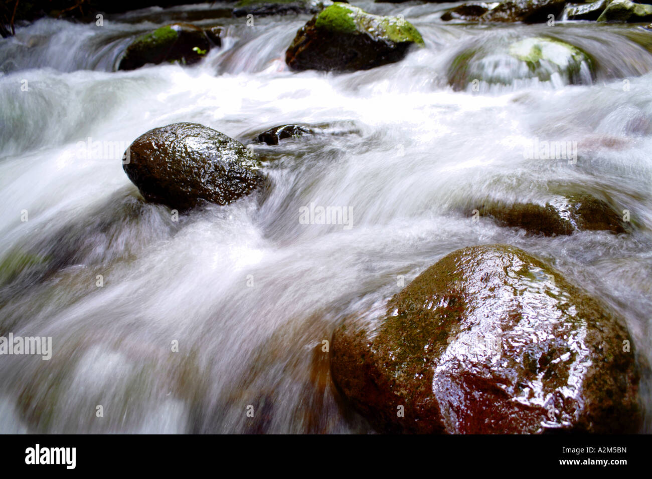 Water flowing over rocks Stock Photo - Alamy