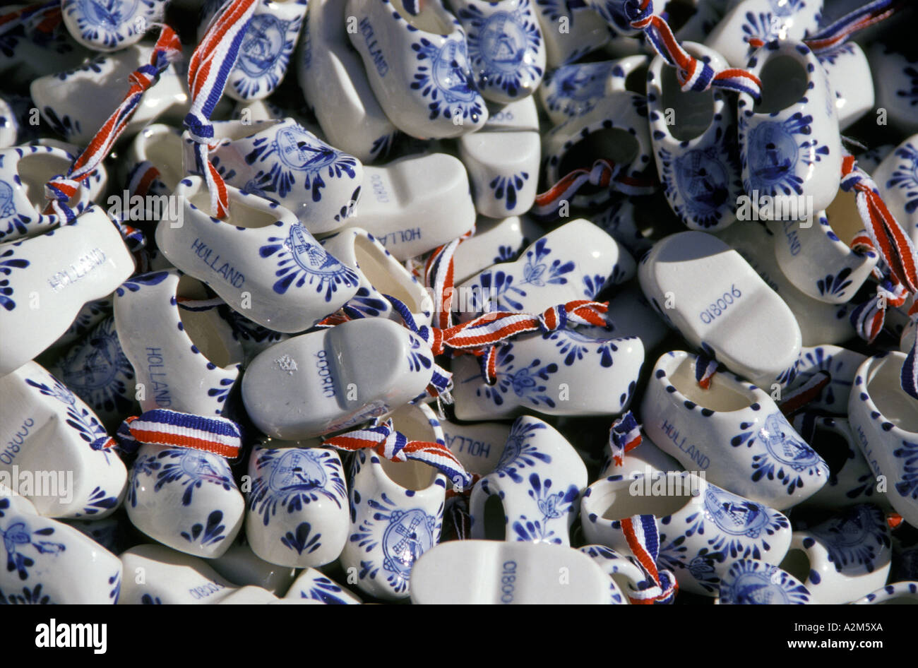 Europe, Netherlands, Amsterdam. Souveniers, tiny clogs with Delft-blue ...