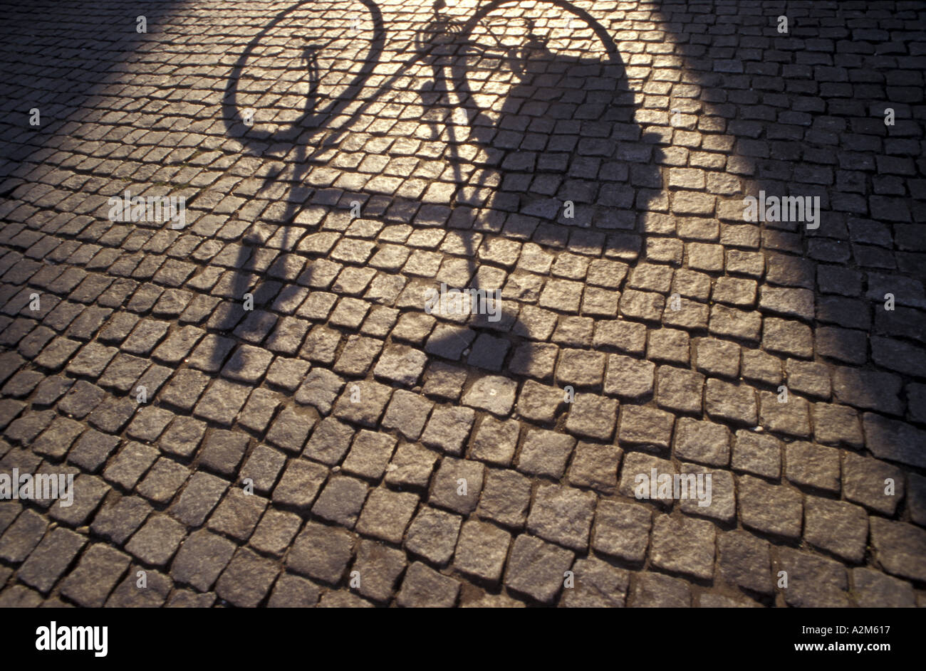 Bicycle s shadow Stock Photo - Alamy