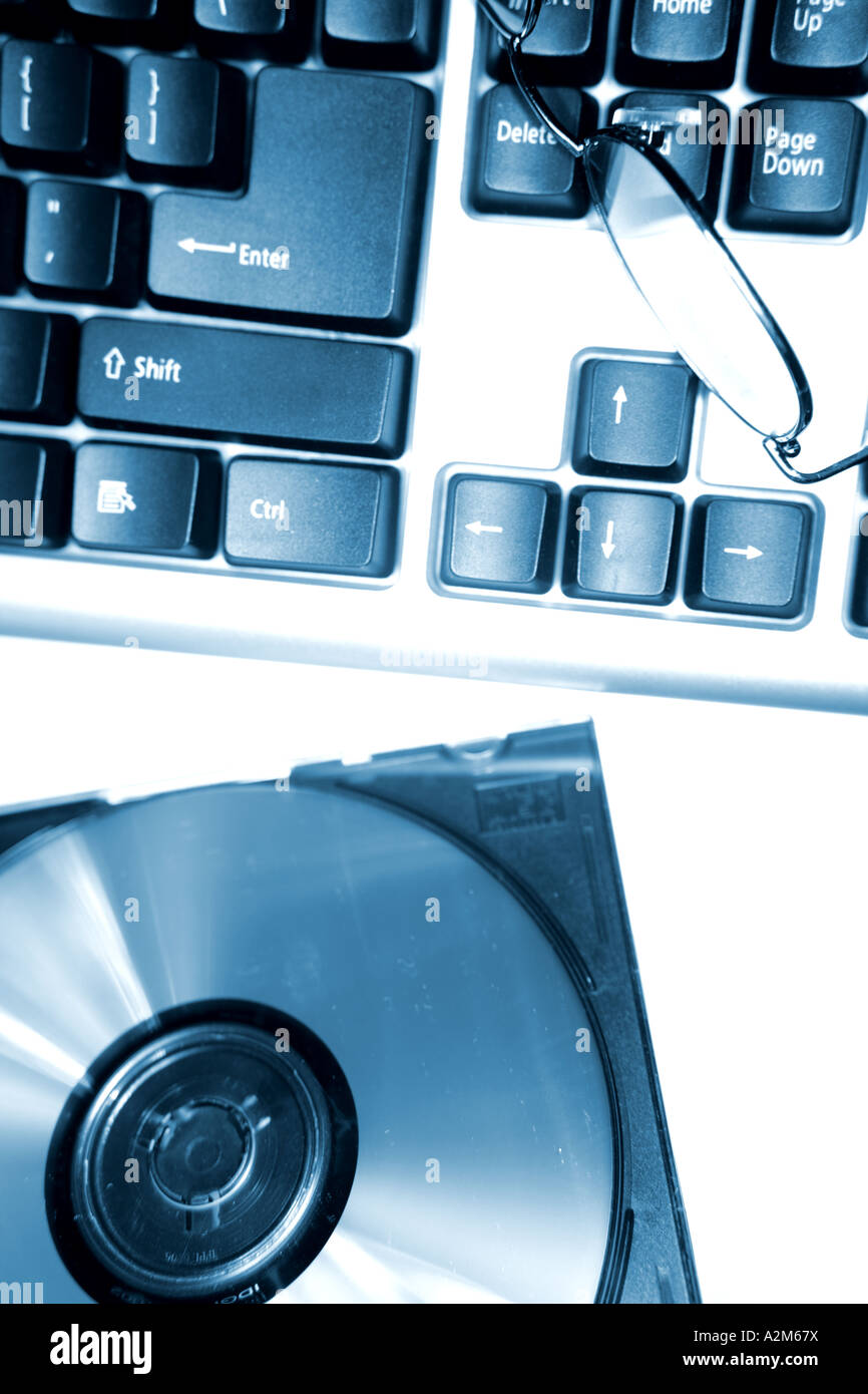 Eyeglasses on computer keyboard and Cd Stock Photo - Alamy