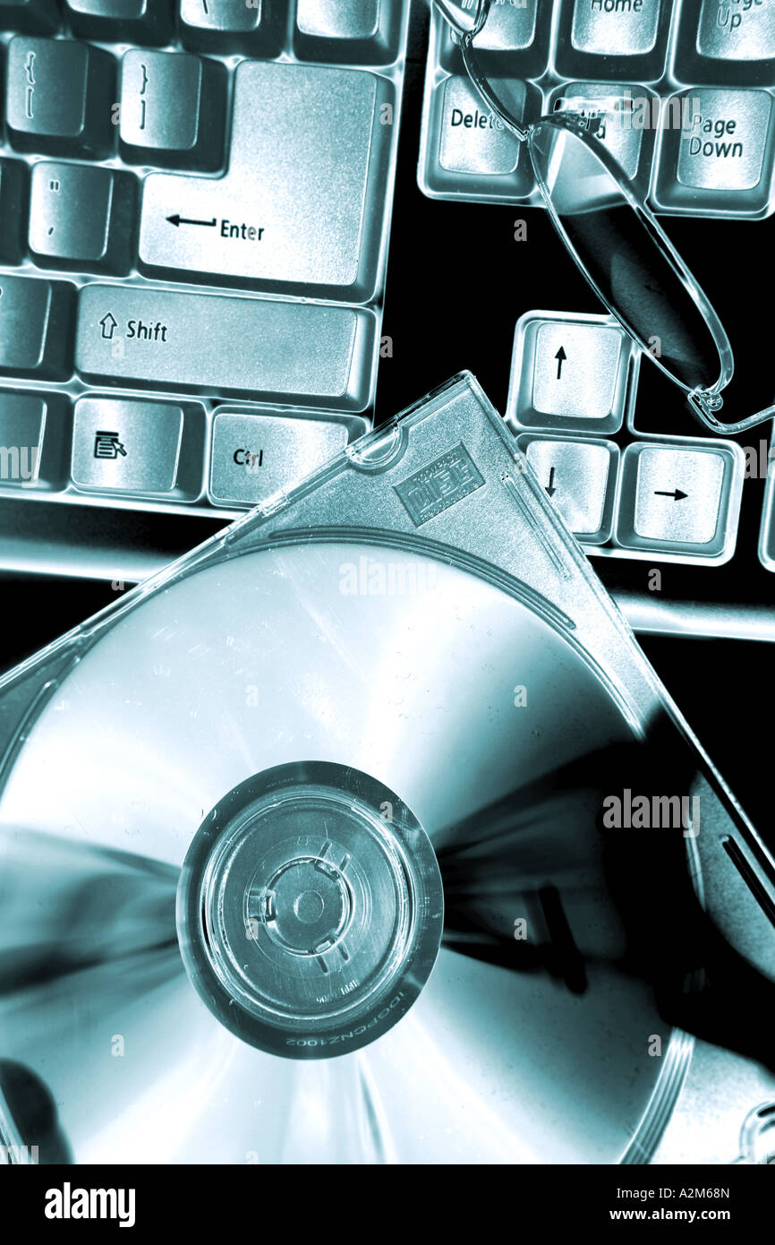 Eyeglasses on computer keyboard and Cd Stock Photo - Alamy
