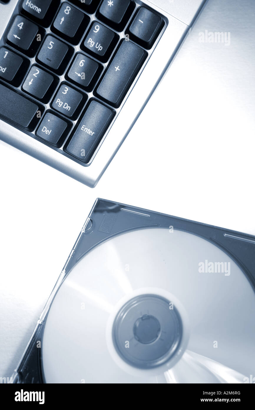 Computer keyboard and CD Stock Photo - Alamy