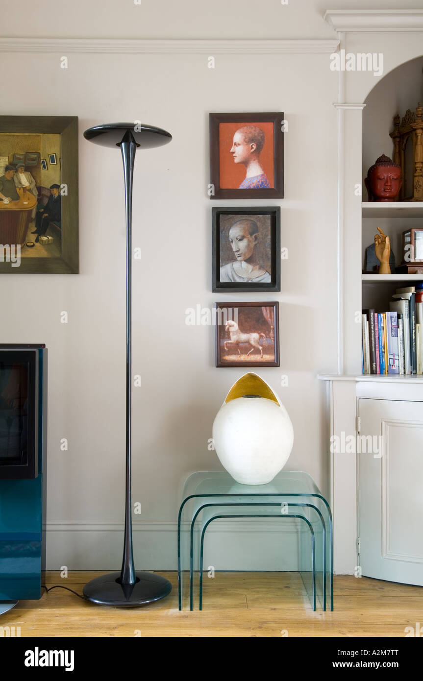 Nest of glass tables in living room with standard lamp, recessed ...