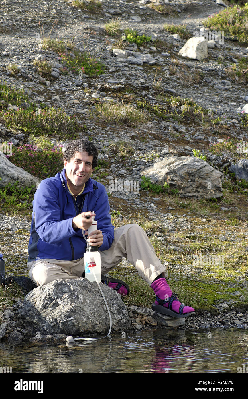 Man pumping water hi-res stock photography and images - Alamy